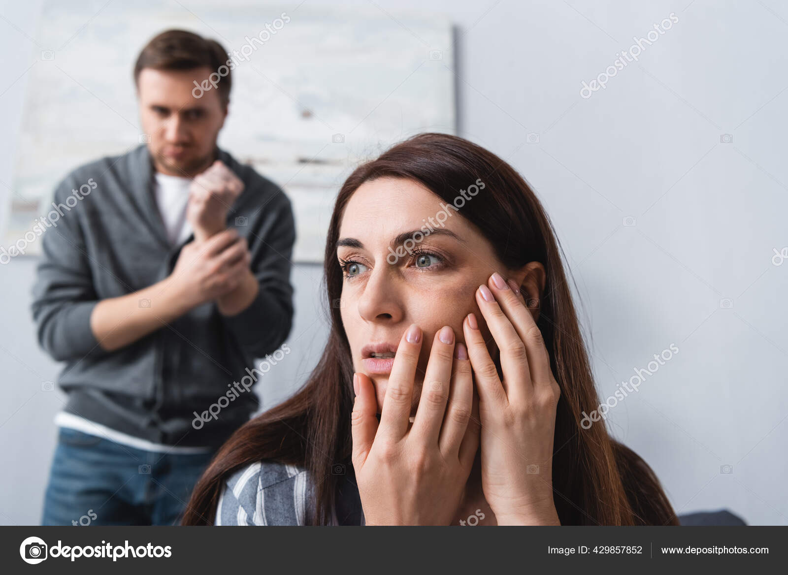 Woman Touching Cheek Bruise Abusive Husband Showing Fist Blurred ...