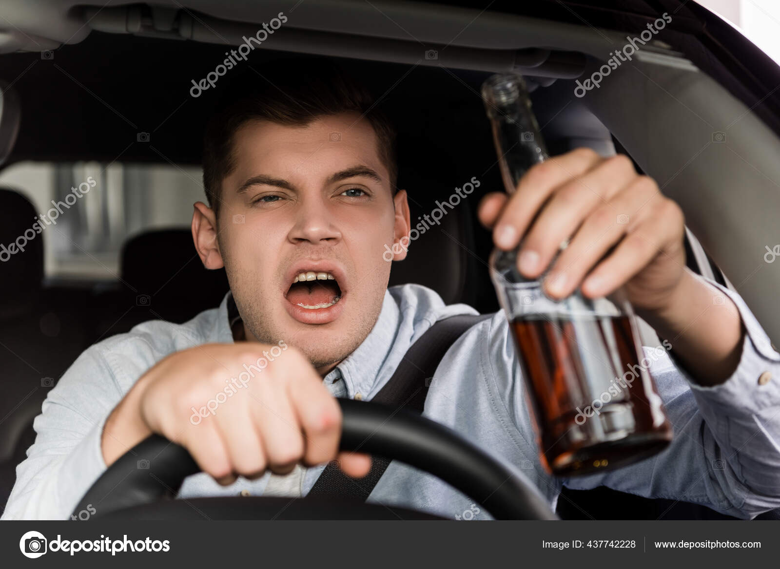 Drunk Aggressive Man Shouting While Driving Car Holding Bottle Alcohol ...