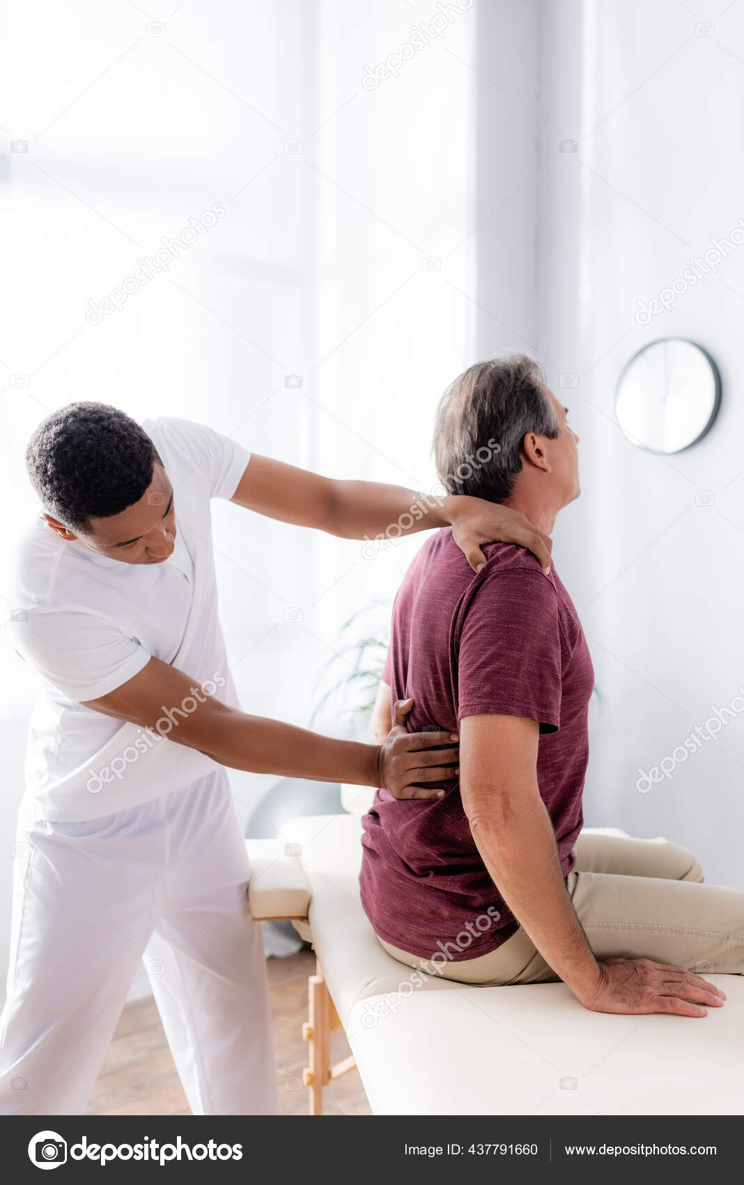 African American Chiropractor Working Back Middle Aged Man Clinic ...