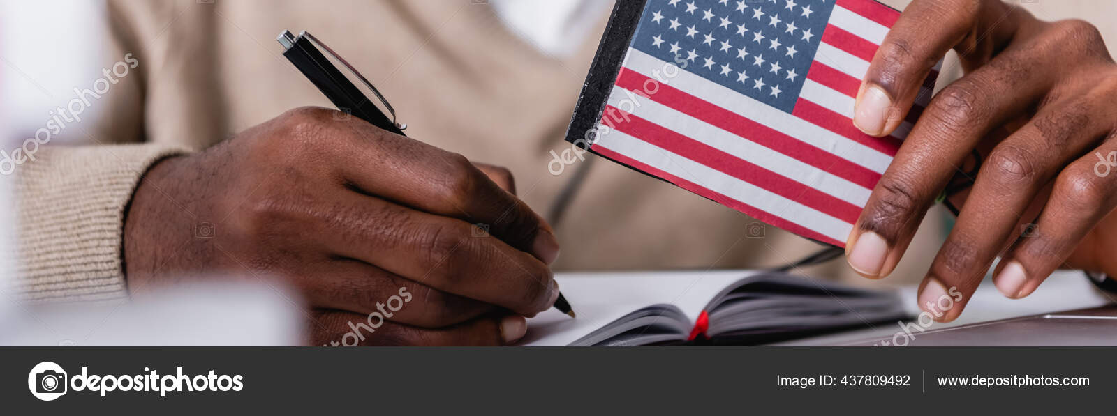 Selective Focus African American Interpreter Writing Notebook While ...