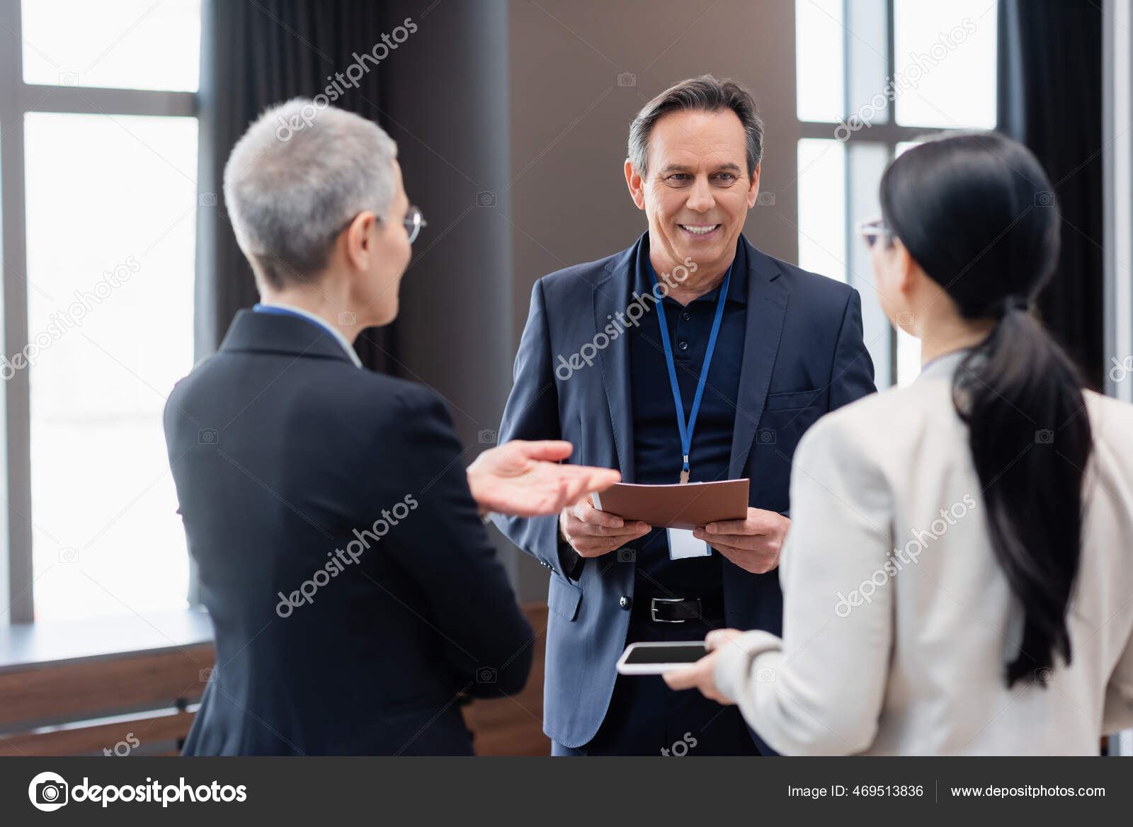 Smiling Businessman Paper Folder Standing Colleagues Smartphone Blurred ...