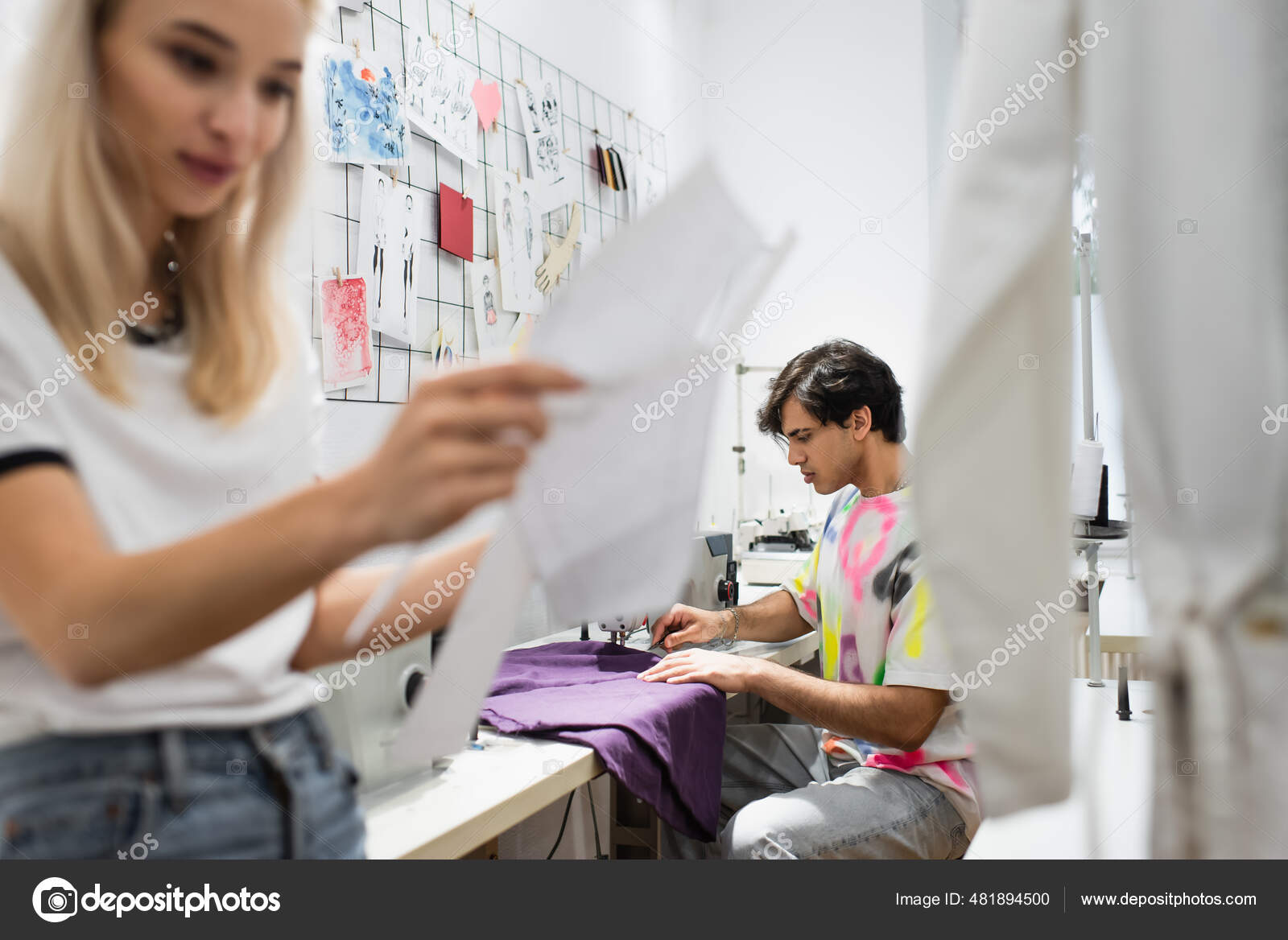 Fashion Designer Holding Sewing Patterns Tailor Working Sewing Machine ...