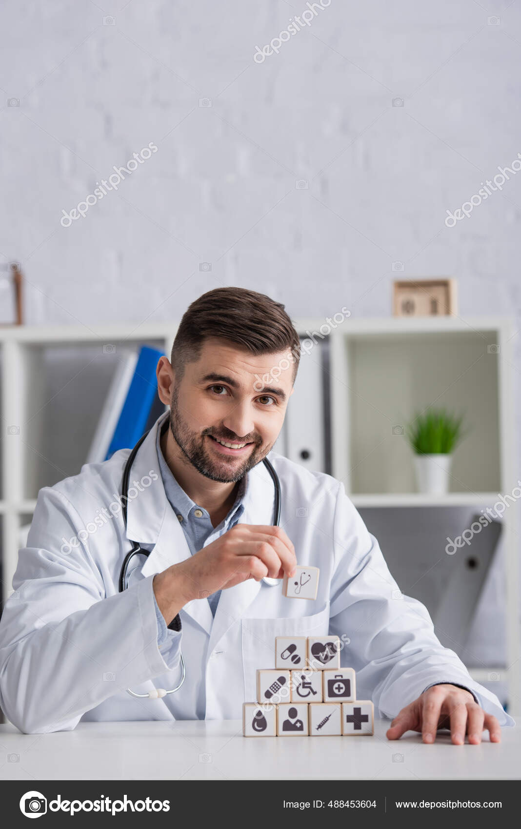 Happy Doctor Looking Camera While Making Pyramid Medical Symbols Desk ...