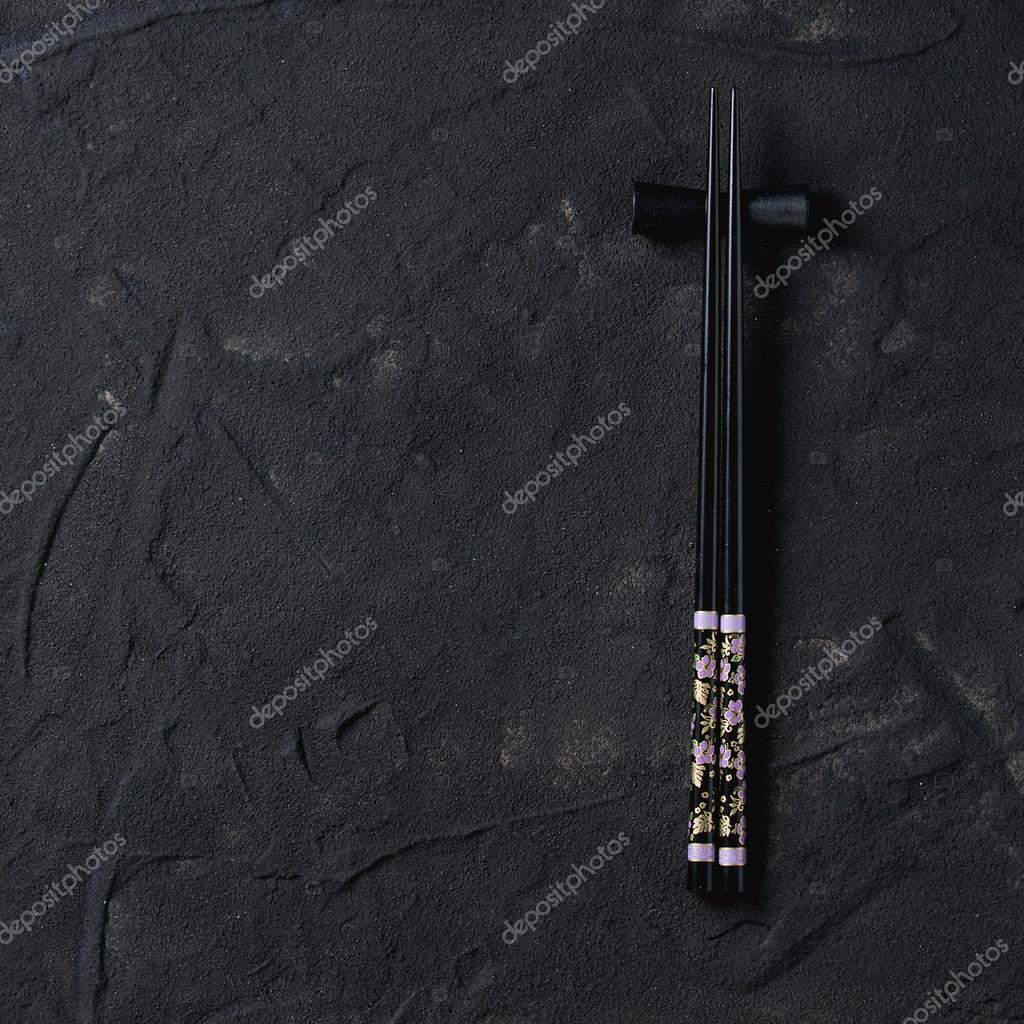 Black chopstics over textured surface Stock Photo by ©NatashaBreen ...