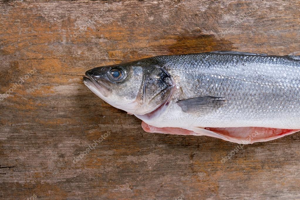 Raw seebass fish Stock Photo by ©NatashaBreen 111122546