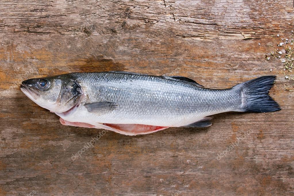 Raw seebass fish Stock Photo by ©NatashaBreen 111123972
