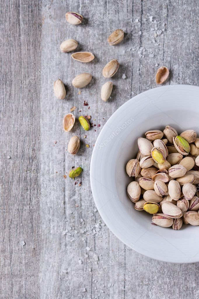 Salted roasted pistachios Stock Photo by ©NatashaBreen 111147094