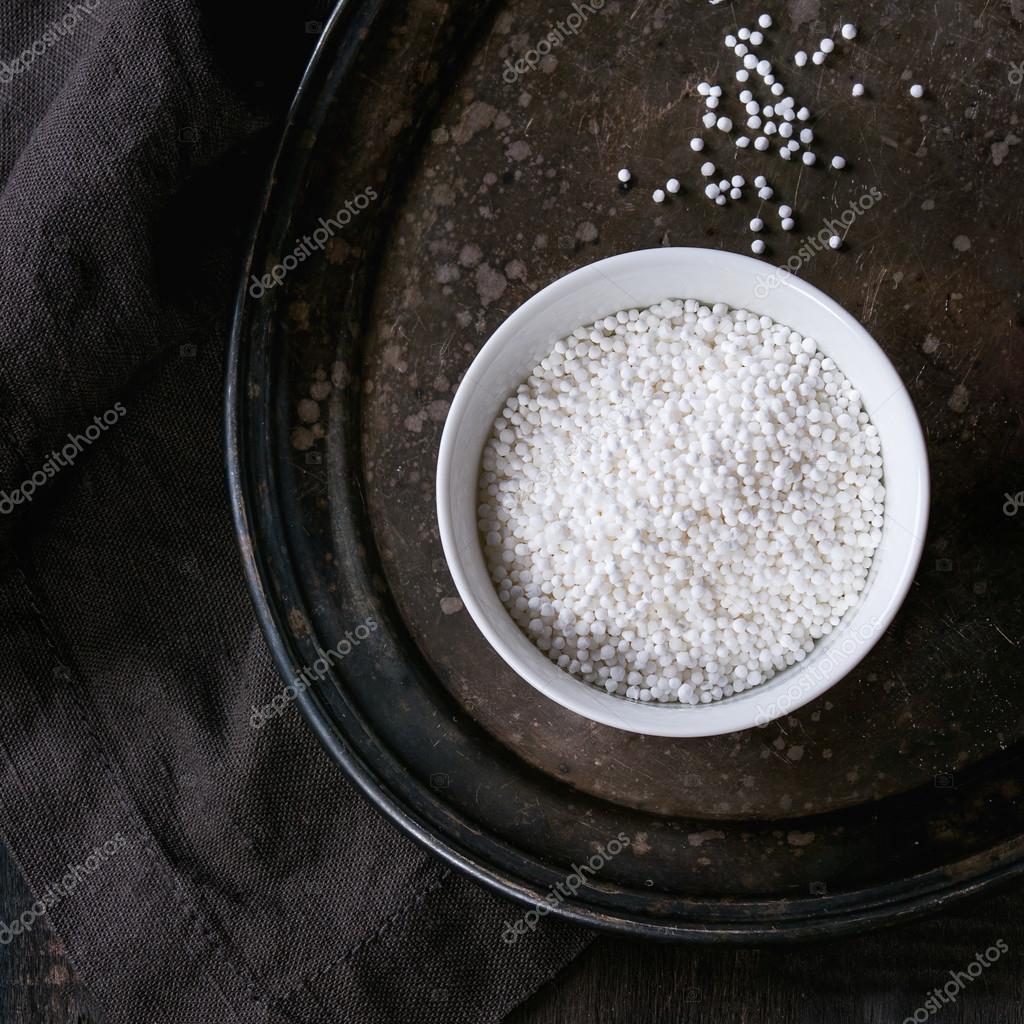 Uncooked tapioca pearls Stock Photo by ©NatashaBreen 115840136