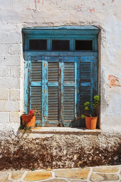Rustic blue window in Halki, Naxos Island, Greece. - Stock Image ...