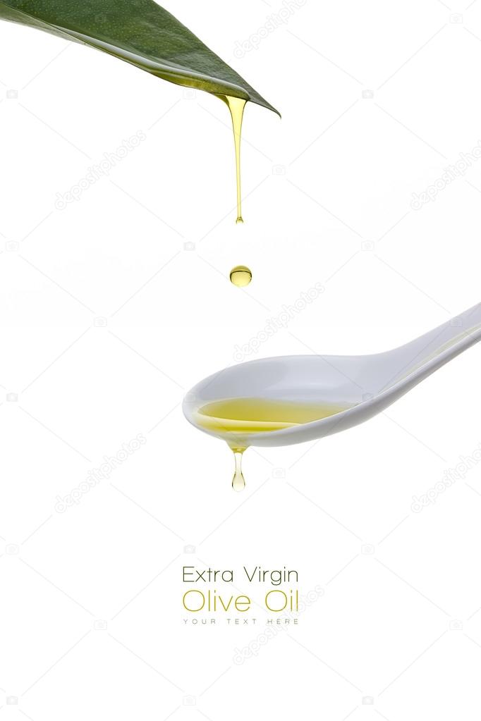 Olive oil dripping from a fresh green leaf over a ceramic spoon Stock ...