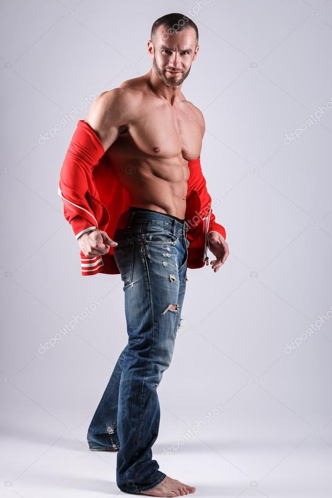 Muscular man in red jacket Stock Photo by ©AY_PHOTO 106328458