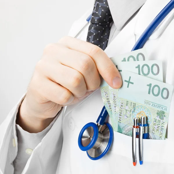 Doctor putting money into his pocket - health care concept - Stock ...