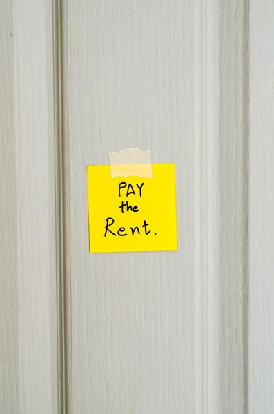 Sticky note write a message pay the rent Stock Photo by ©ammza12 56761051