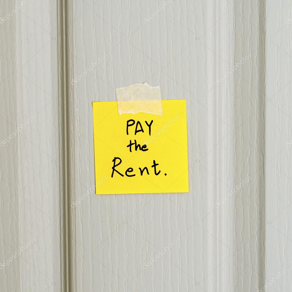 Sticky note write a message pay the rent Stock Photo by ©ammza12 56761051