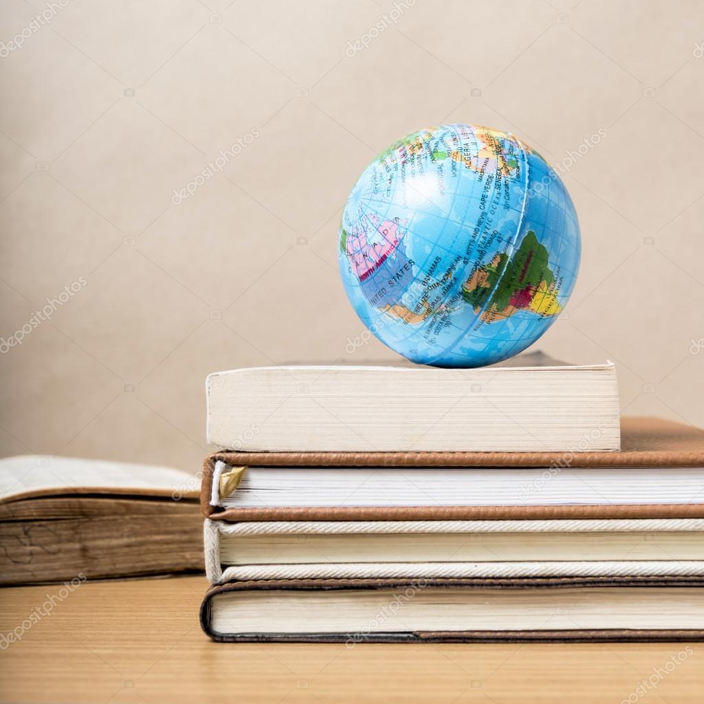 Book and earth ball Stock Photo by ©ammza12 78328900
