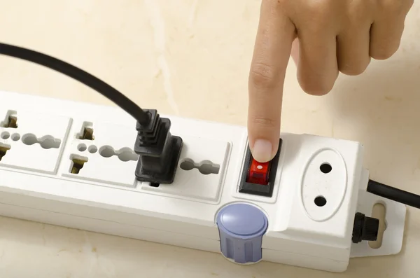 Hand turn on switch multiple socket plug Stock Photo by ©ammza12 56763945
