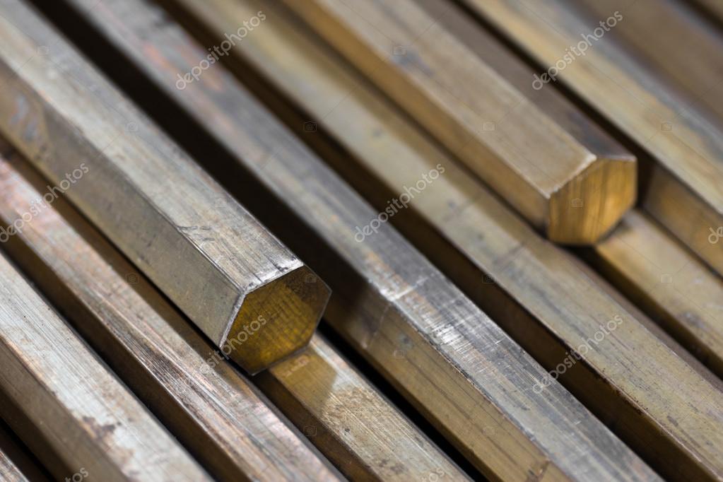 Brass hexagonal rods closeup Stock Photo by ©AleksWolff 52649547