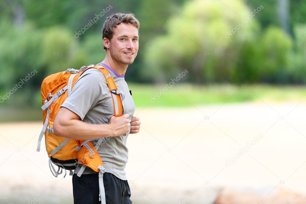 Hiking man with backpack in nature Stock Photo by ©Maridav 72654151