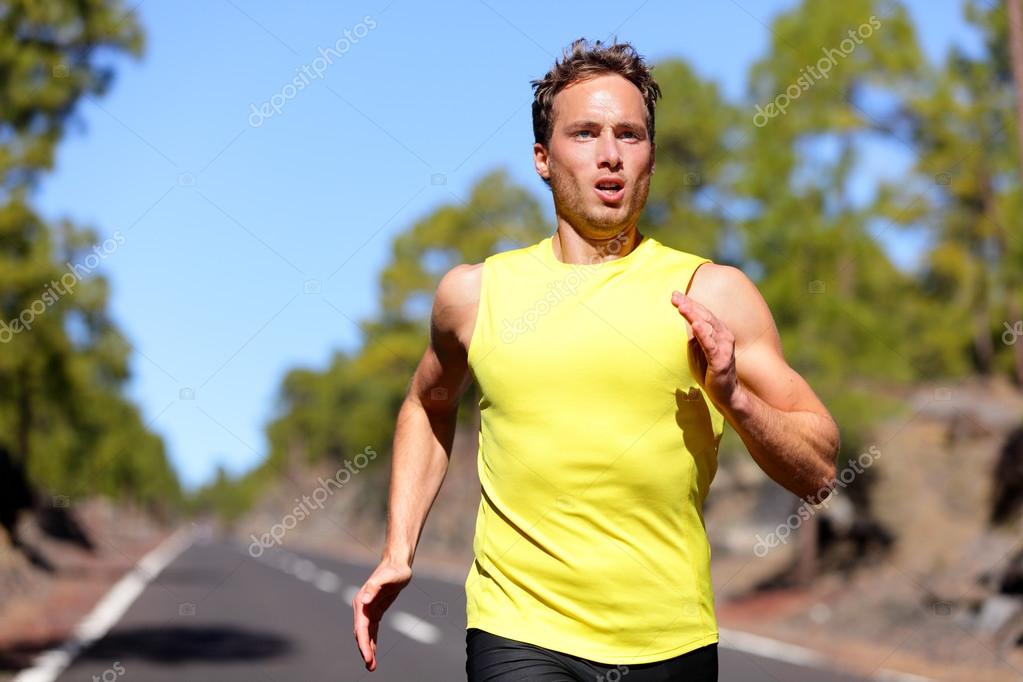 Male athlete runner training at fast speed — Stock Photo © Maridav ...