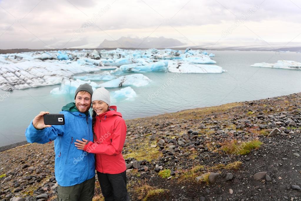 Couple taking selfie on Iceland Stock Photo by ©Maridav 73836991