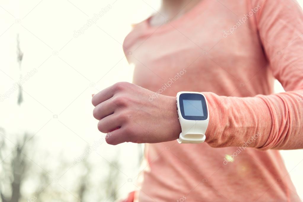 Runner using sports smartwatch — Stock Photo © Maridav #73838129