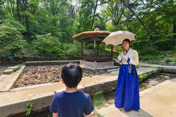 SEOUL, SOUTH KOREA - Female Korean tour guide in a traditional clothe ...