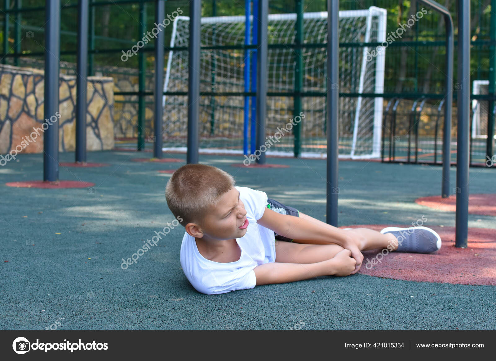 Boy child hit on the gym outside, child injured limb on the playground ...