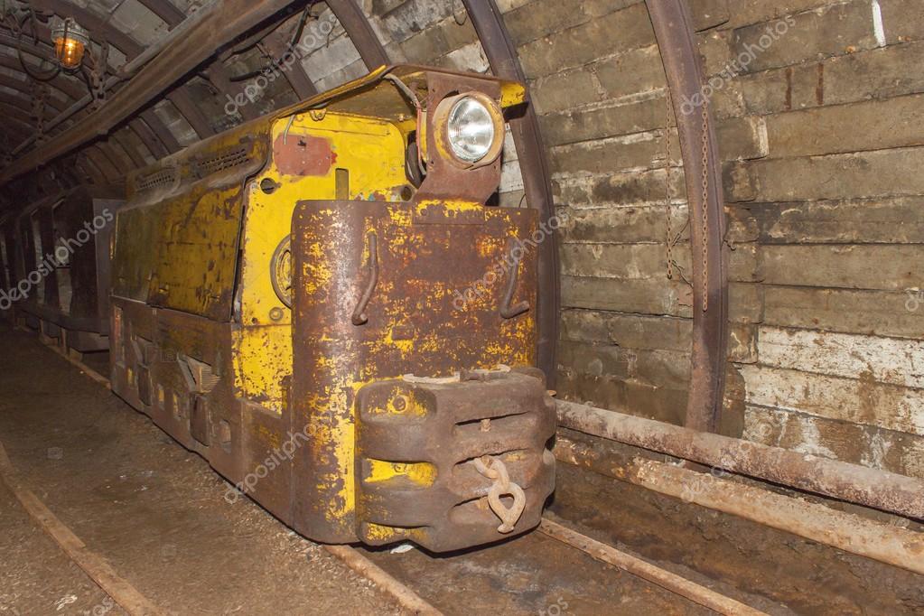 An old, abandoned coal mine and mine train. Coal mining in the ...