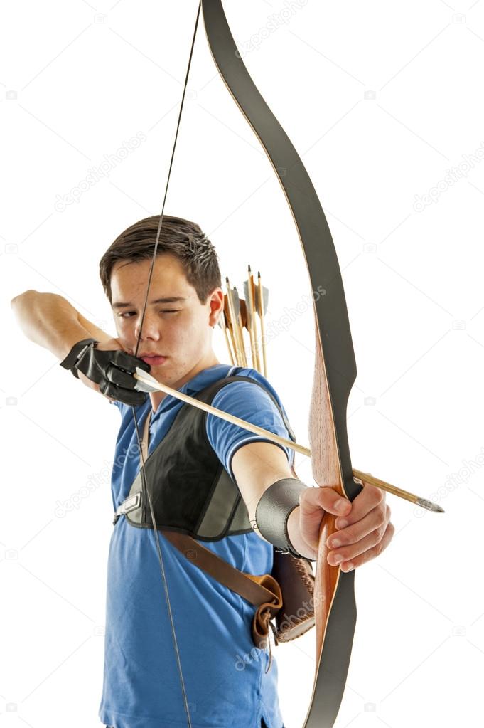 Boy aiming with bow an arrow — Stock Photo © YellowPaul #57742911