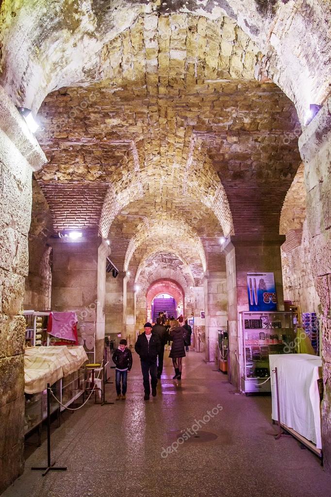 Tourists take a tour of the historic cellars of the Roman Emperor ...