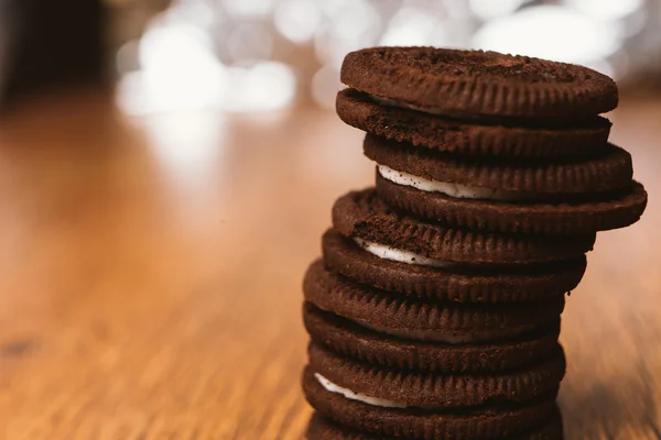 Stack of cookies on dark blurred background - Stock Image - Everypixel