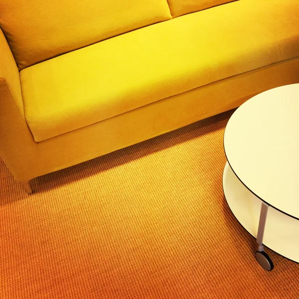 Bright yellow sofa and coffee table - Stock Image - Everypixel