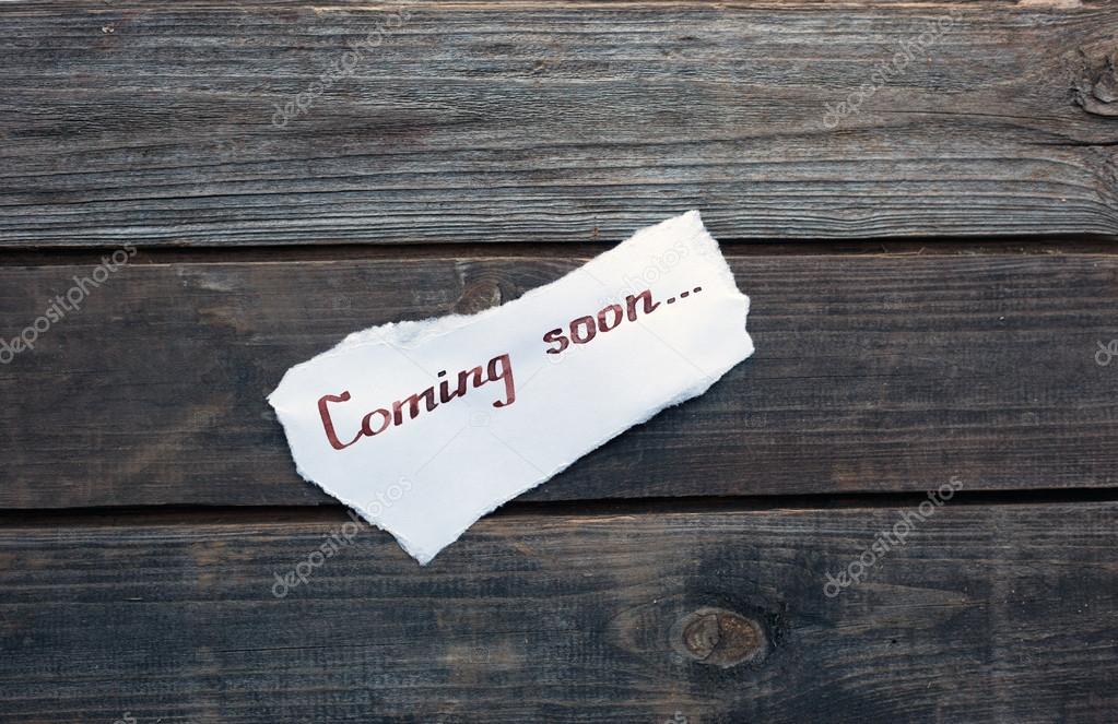 Coming soon hand written on paper piece — Stock Photo © bluecaterpillar ...