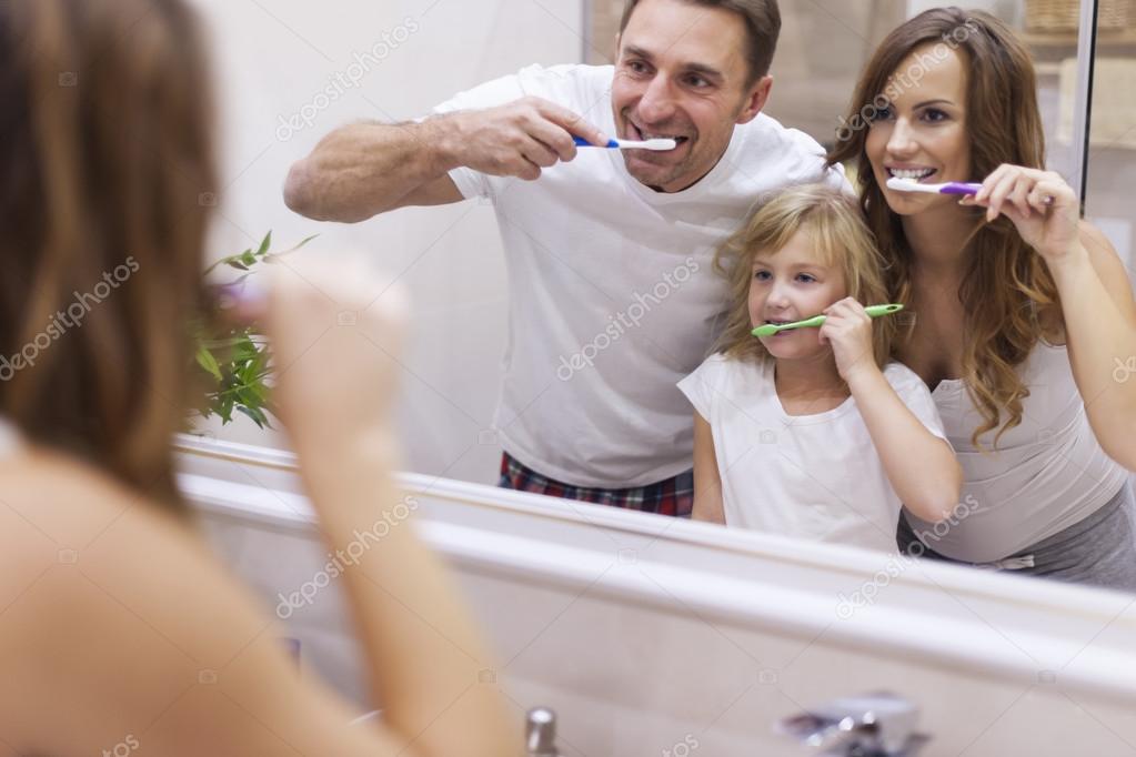 Family brushing teeth Stock Photo by ©gpointstudio 58262085