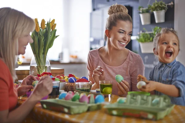 Family decorating Easter eggs Stock Photo by ©gpointstudio 65146767
