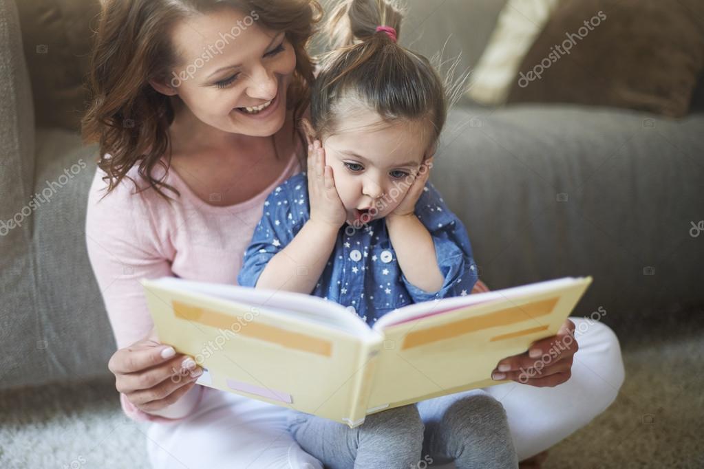 Mother and daughter read book Stock Photo by ©gpointstudio 72811265