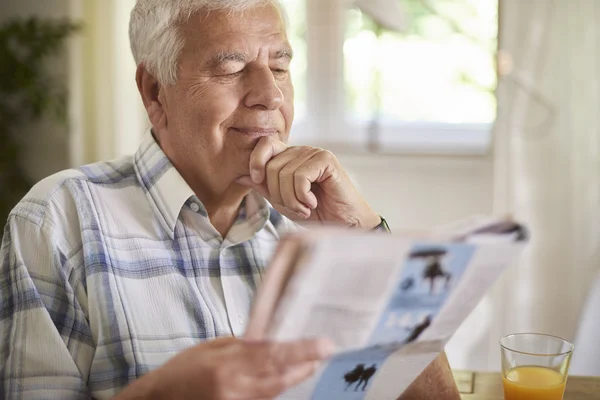 Senior man reading newspaper - Stock Image - Everypixel