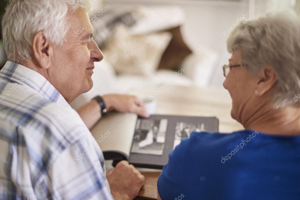 Senior couple reminiscing good old times — Stock Photo © gpointstudio ...