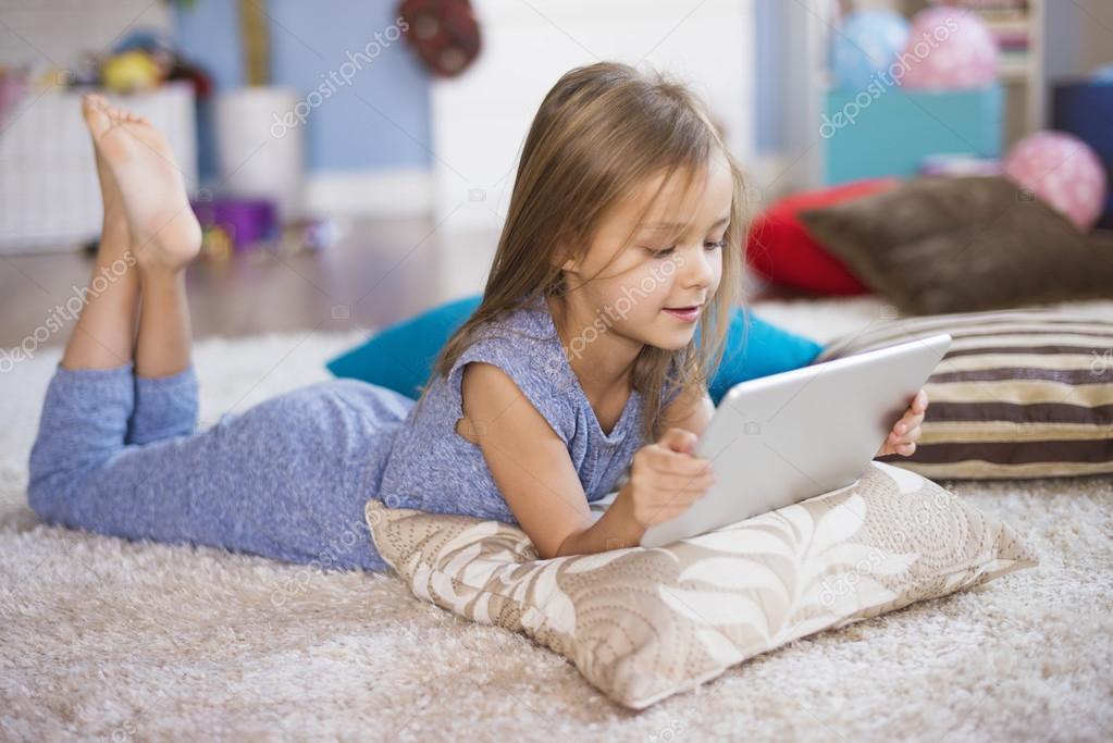 Girl playing with tablet — Stock Photo © gpointstudio #96508864