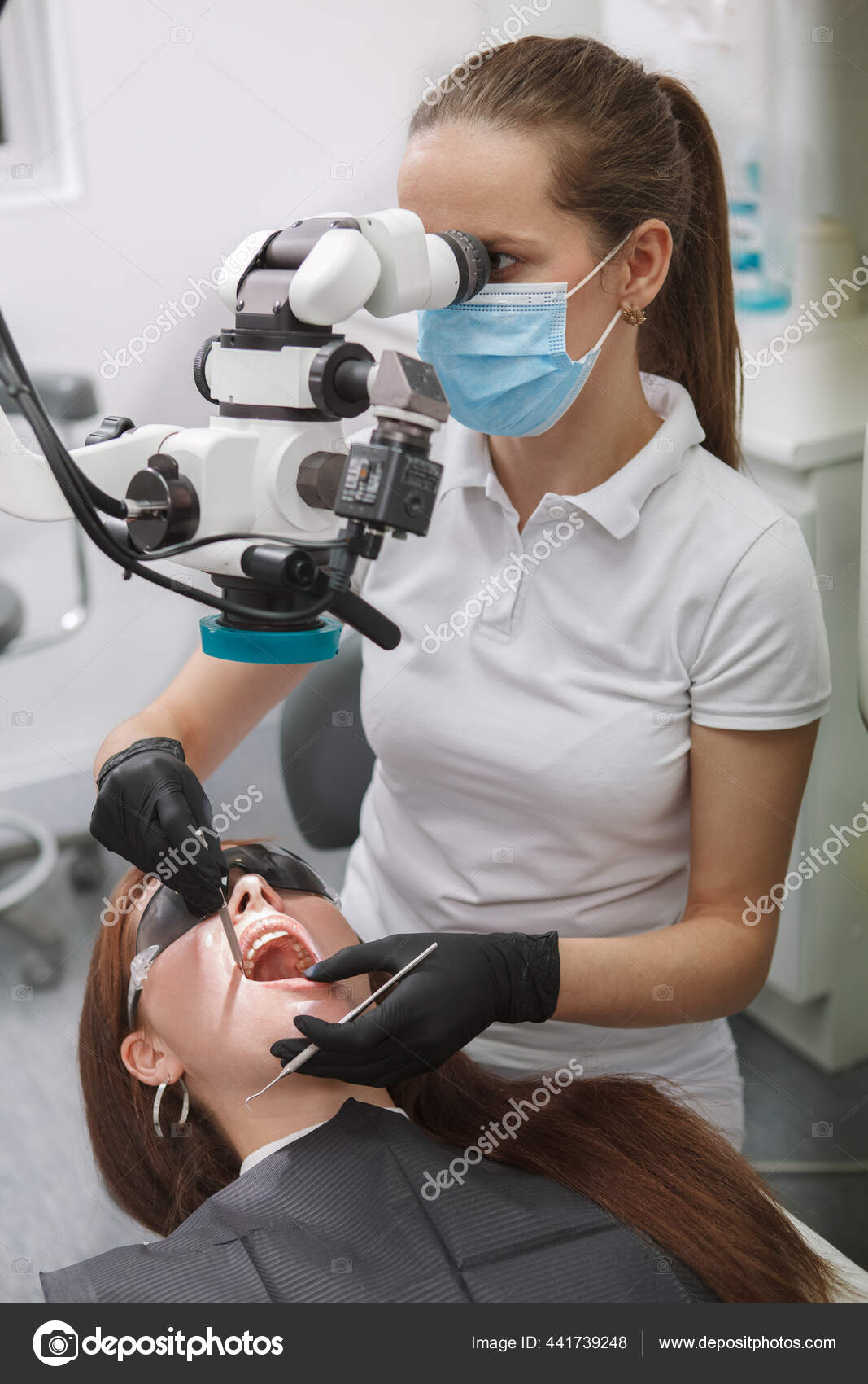 Vertical Shot Professional Dentist Using Dental Microscope Examining ...