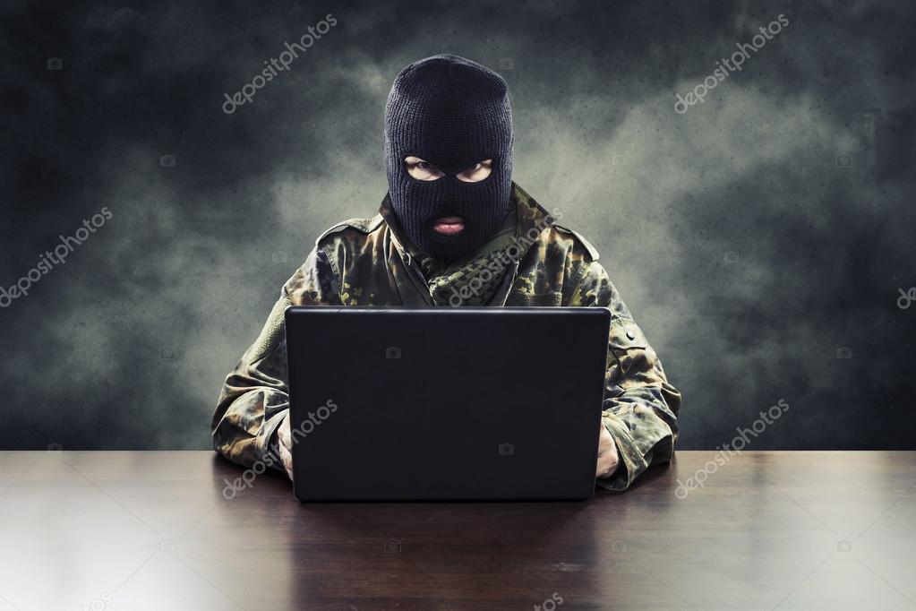 Cyber terrorist in military uniform — Stock Photo © mikkolem #80648490
