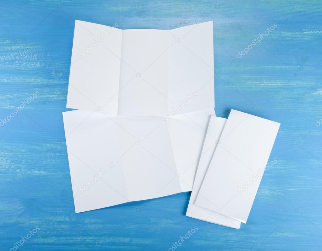 Blank white folding paper flyer Stock Photo by ©fontgraf 73635659