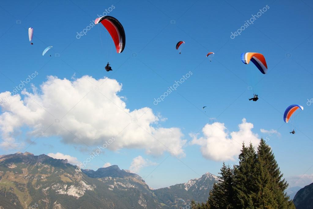 Group of paragliders in mountainous landscape — Stock Photo © SusaZoom ...