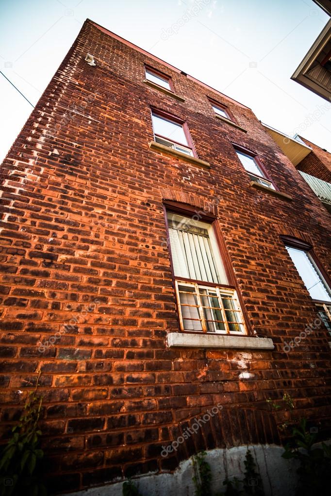 High Apartment Block and Brick Wall in the Poor Trois-Riviere Ar ...