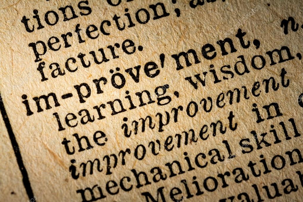 Close-up of the word IMPROVEMENT and its definition — Stock Editorial ...