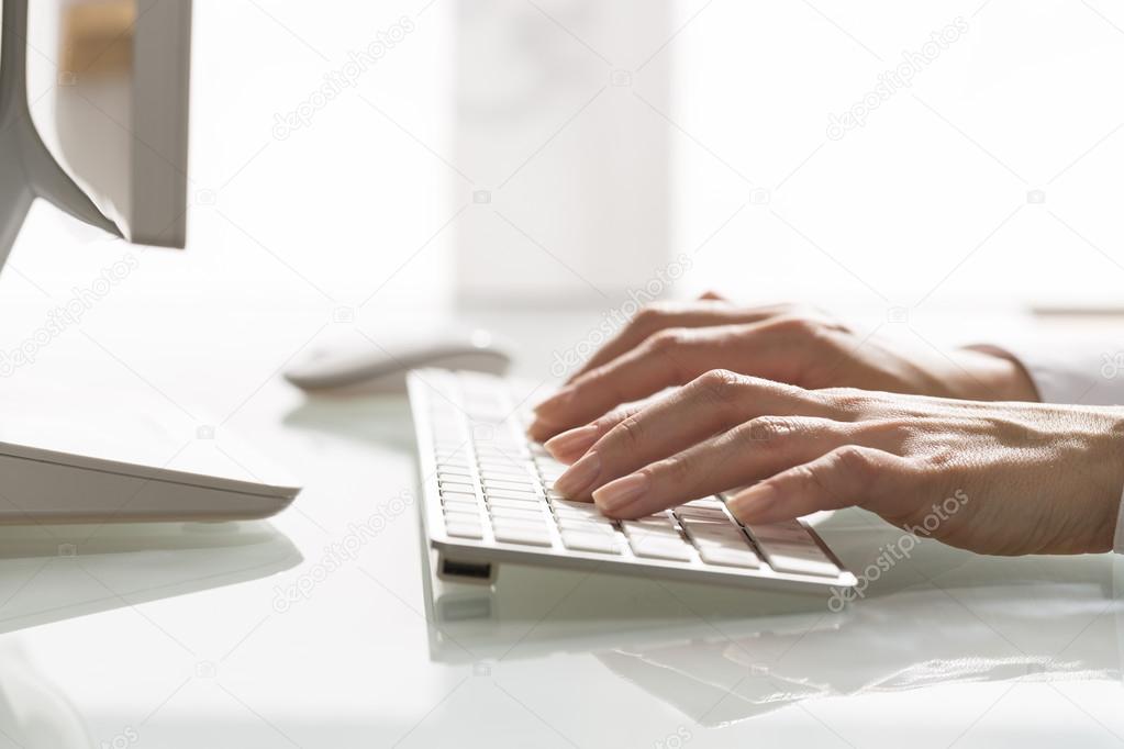Woman using keyboard Stock Photo by ©LDProd 58260821