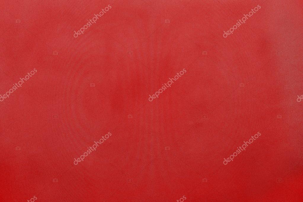 Grained textured background from fabric of bright red monochrome color ...