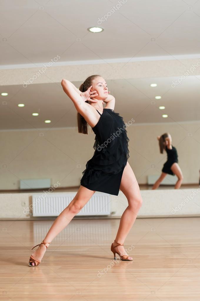 Young girl doing exercises in a dance class — Stock Photo © Capable97 ...