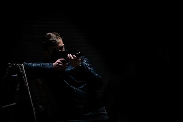 handsome man pointing with gun — Stock Photo © coolfonk #19531251