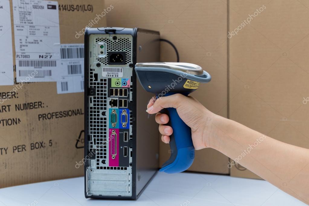 Holding and Scanning label on the computer with bluetooth barcod Stock ...